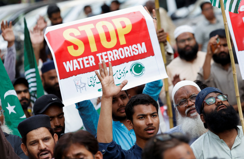 Pakistan bars Indian ships, test-fires missile as tensions soar