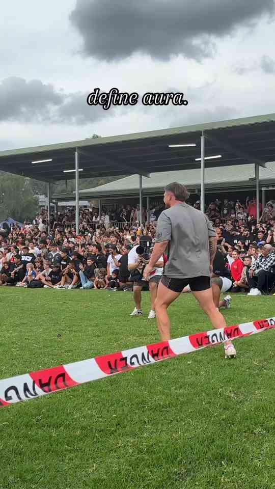 Intense Rugby Tackle Challenge in Front of Packed Spectator Crowd