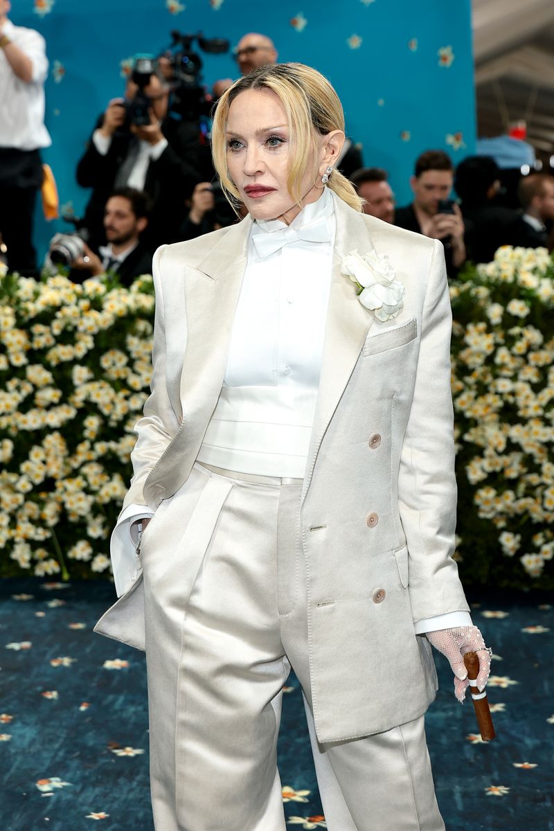 Madonna Returns to the Met Gala With a Sleek Satin Suit—and a Lit Cigar