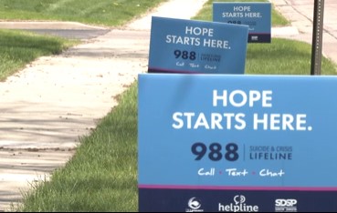 988 signs part of Mental Health Awareness Month