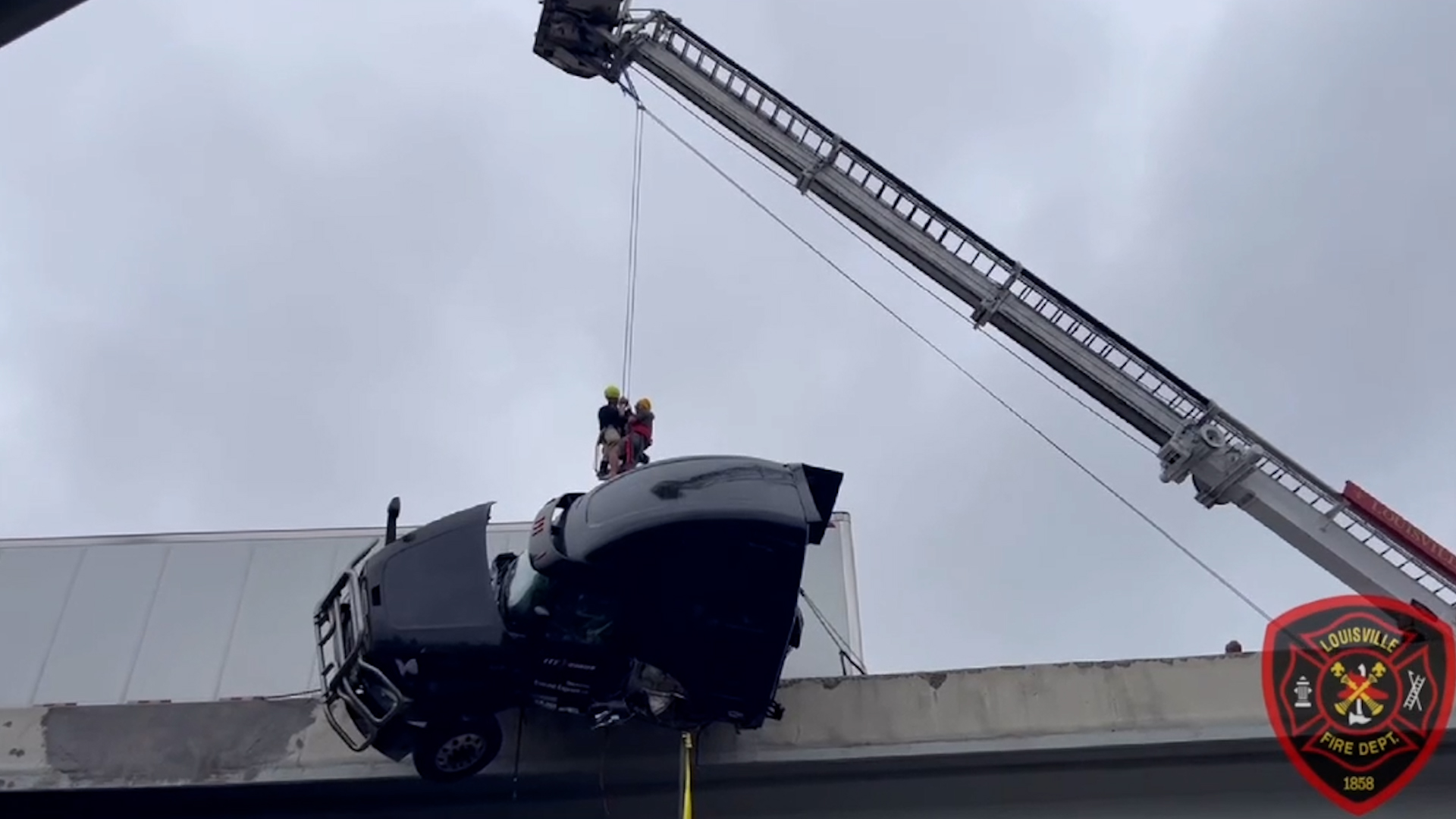 Moment man rescued from semi dangling over bridge in Kentucky