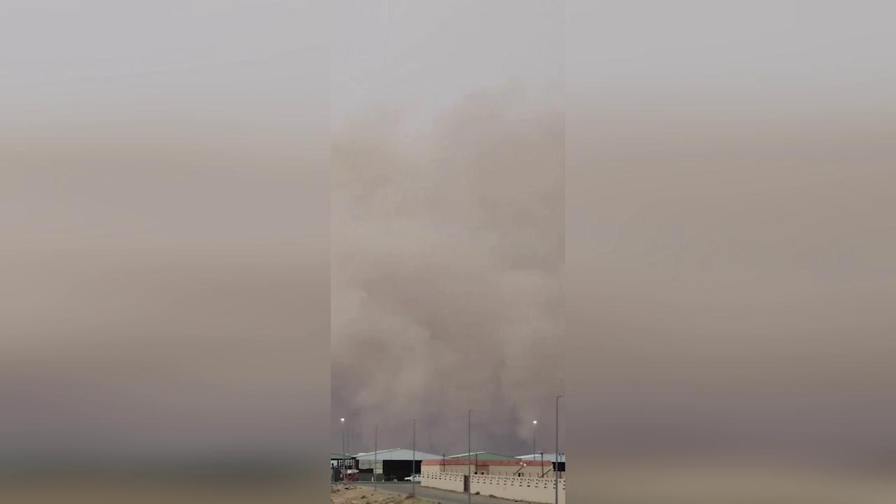 Dust storm cloud towers over homes in Saudi Arabia