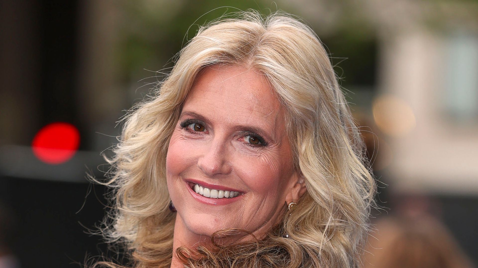 Penny Lancaster shimmers in body-gliding dress alongside towering model ...