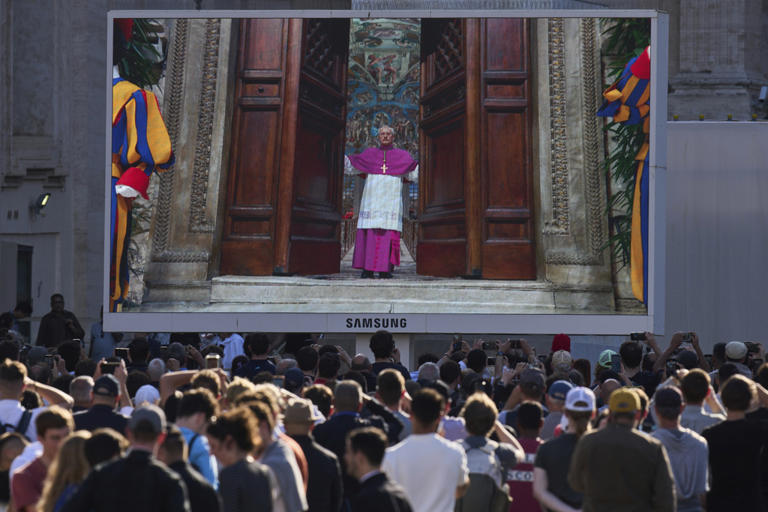 What do the robe colors mean at the Vatican conclave?