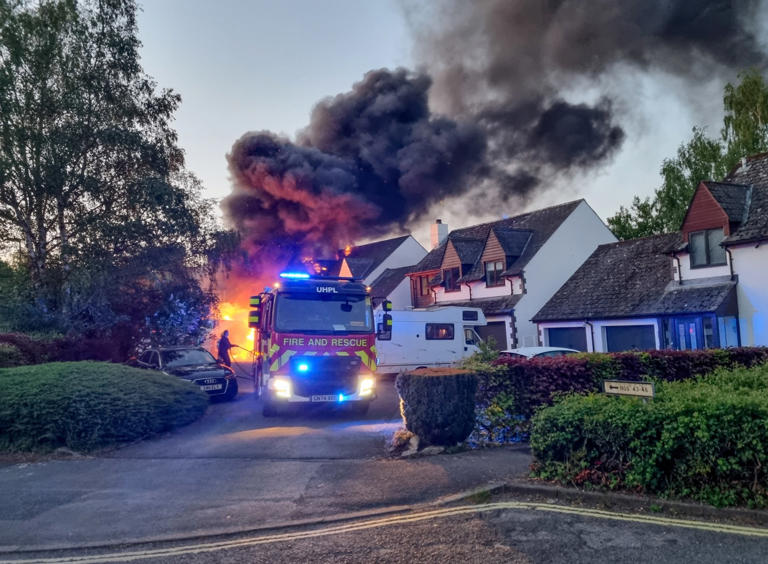 Electric car bursts into flames on driveway and destroys £550,000 ...