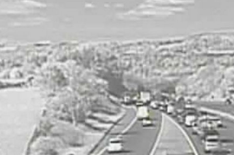 Woman rushed to hospital with serious injuries as M66 shut by police