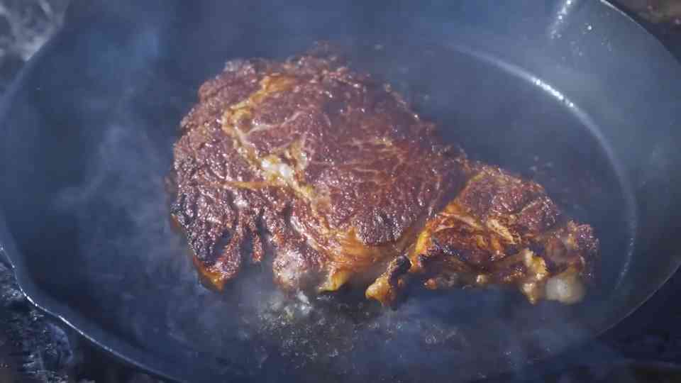 Beef ribeye steak prepared in cast iron skillet