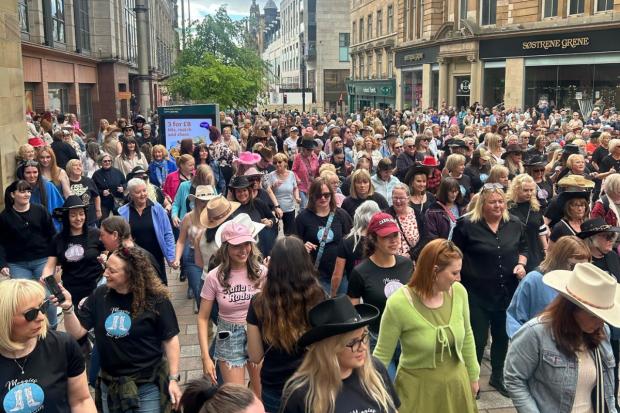 'Yeeha': Line dancers take over Glasgow's Buchanan Street in flash mob ...