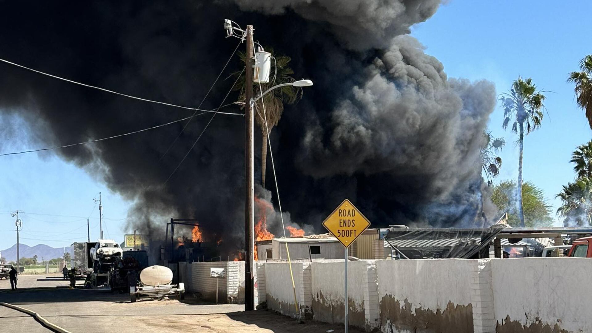 Man burned, 2 firefighters hurt after massive fire engulfs Yuma business