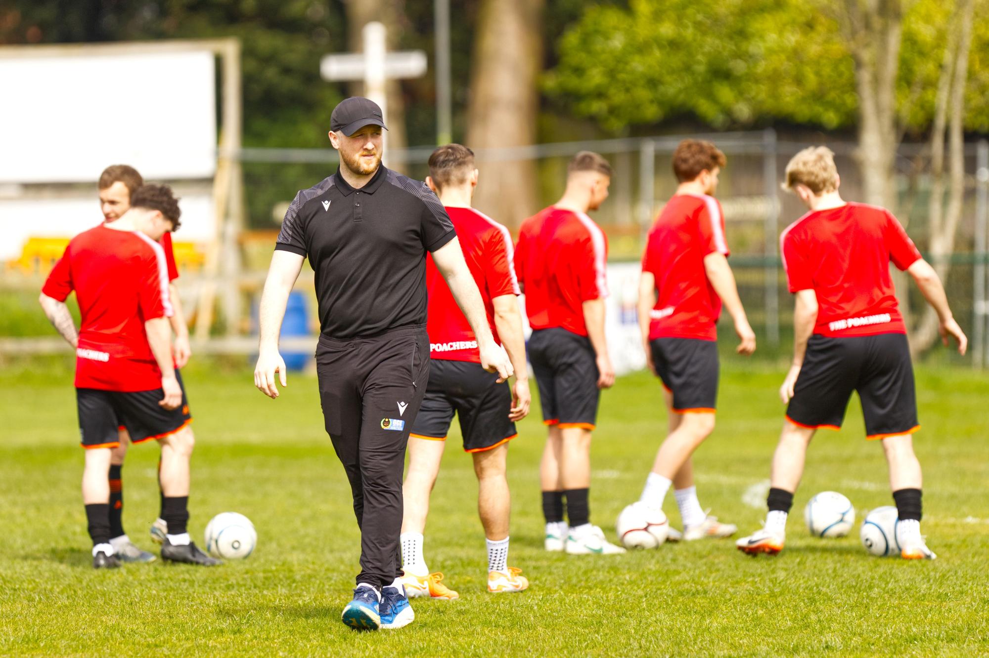 Boston Town boss Chris Funnell puts pen to paper