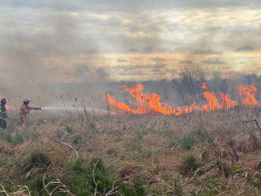 Multiple agencies work to put out 25-30 acre brush fire in Two Rivers