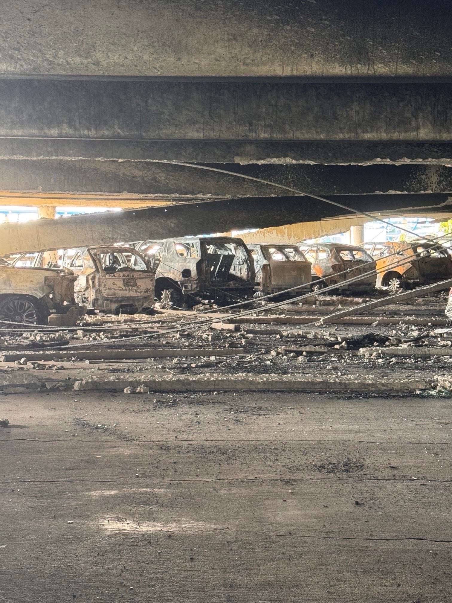 New photos show partial collapse, damaged cars at Jacksonville airport ...