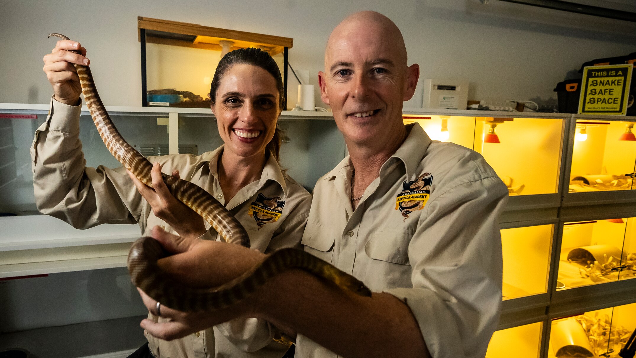 Qld pair teach how to safely handle venomous snakes, tackling ...