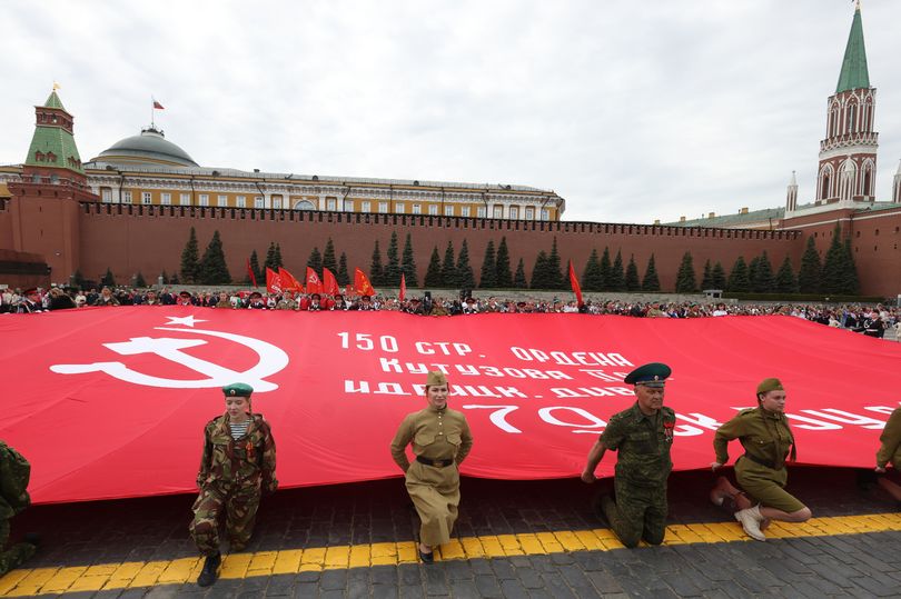 Russia's massive Soviet-era communist parade as Lenin's face lauded in eerie USSR scenes