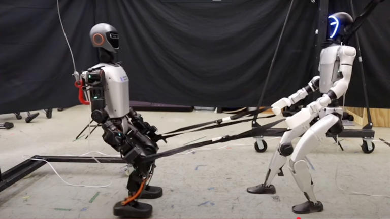 Video: Humanoid robots clash in tug of war, pull cart, open doors to ...