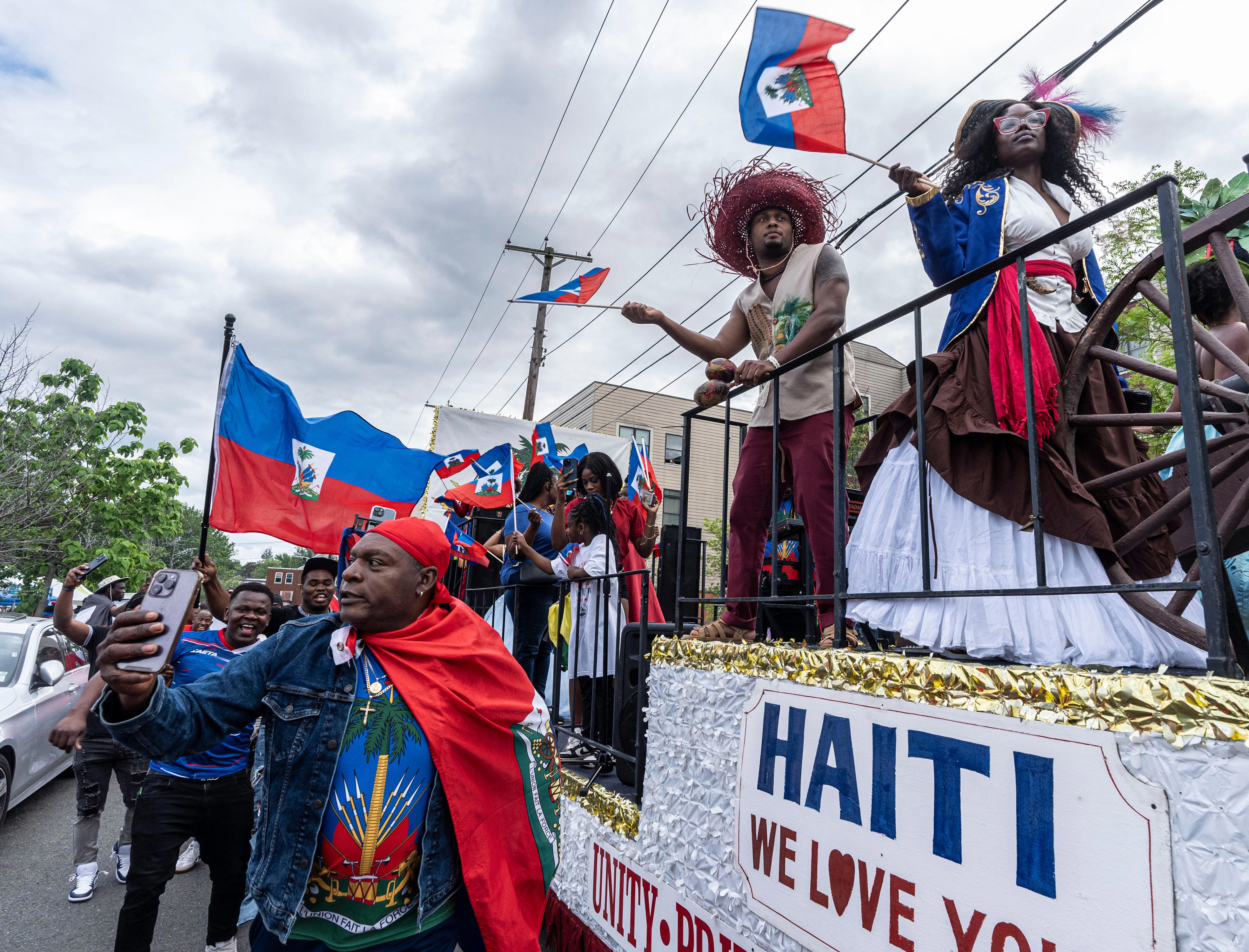 Thousands turn out to celebrate Haitian Flag Day in Spring Valley at ...