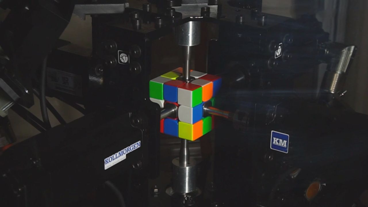 Students create robot that solves Rubik's Cube faster than a blink of ...