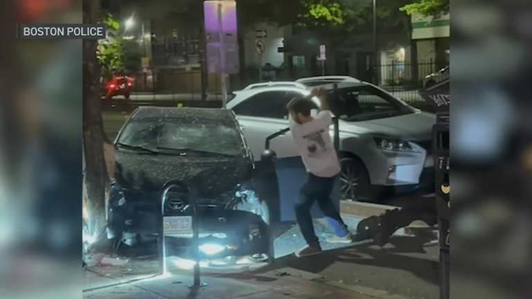 Boston police identify man wanted after car smashed with hatchet