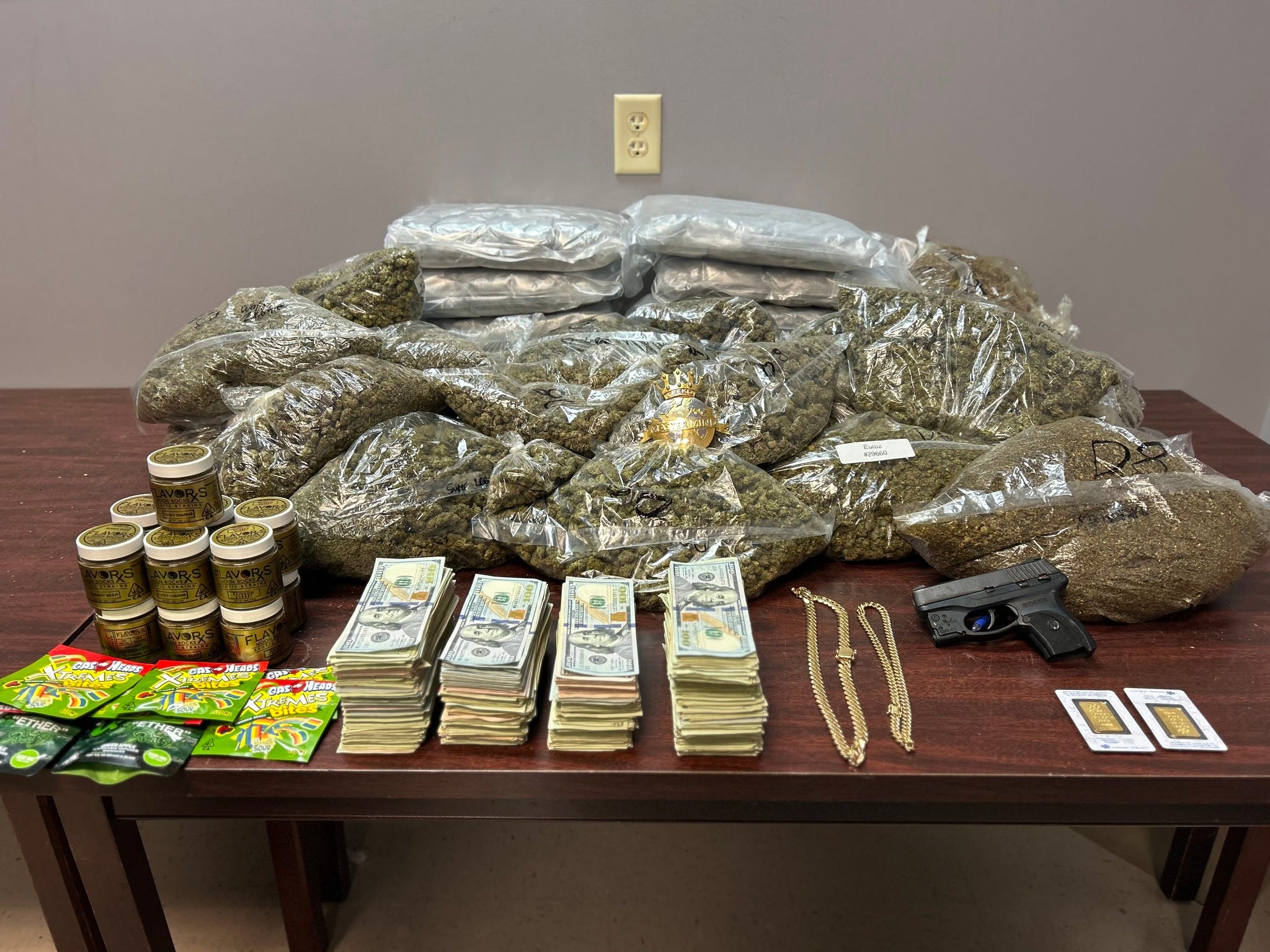 Over 35 pounds of marijuana & 50 grand in cash seized in drug raid