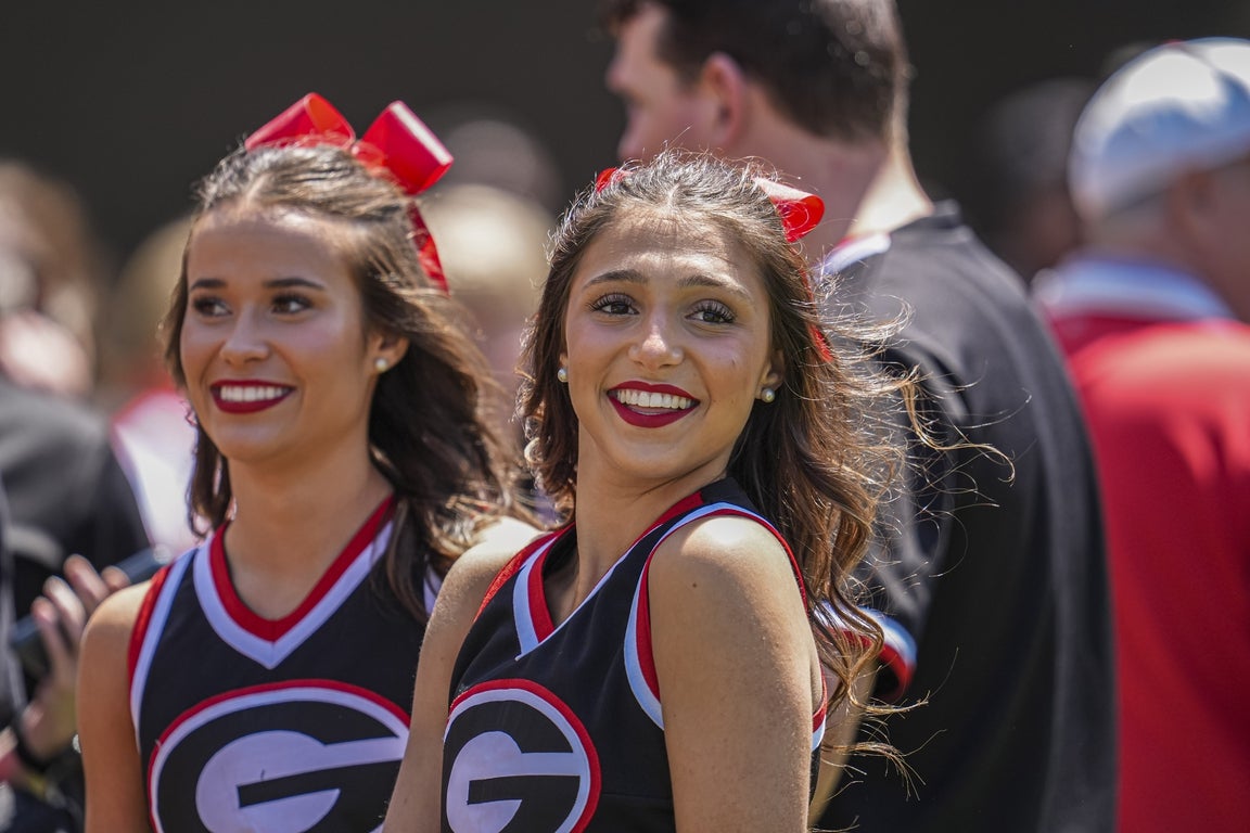 Unforgettable college football cheerleader moments, in photos