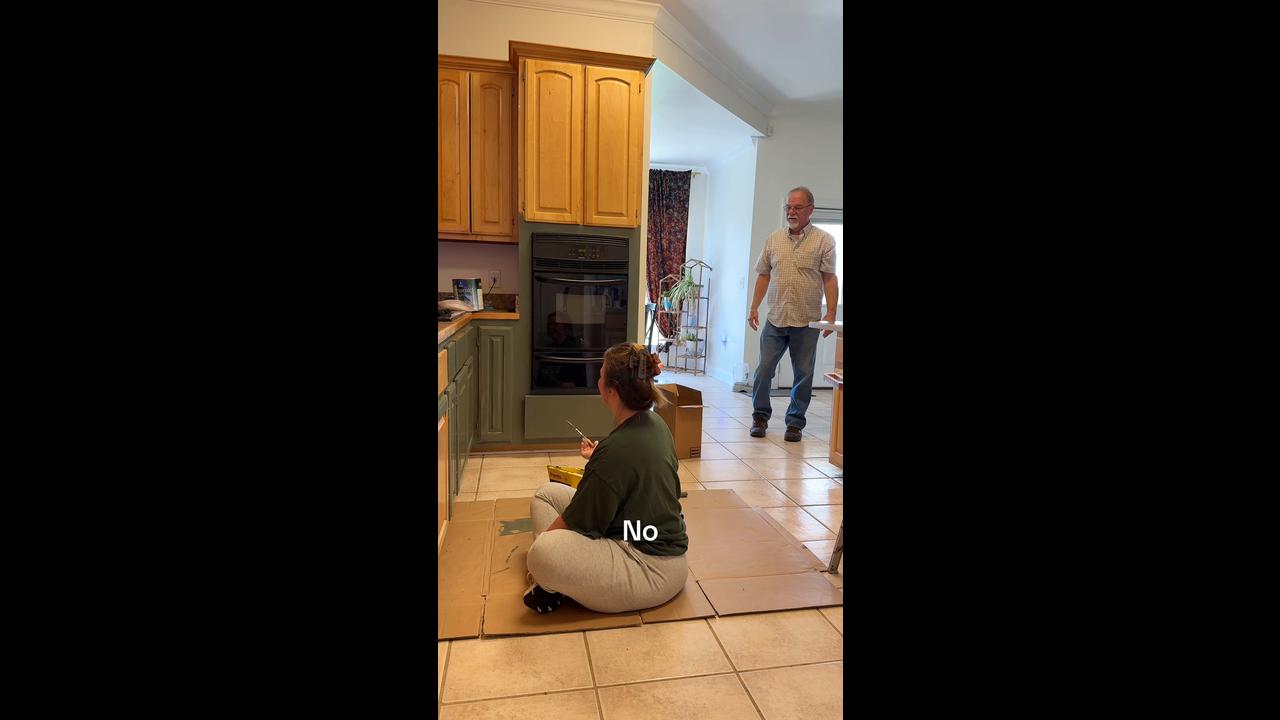 Dad Sighs At Shoddy Cabinet Painting