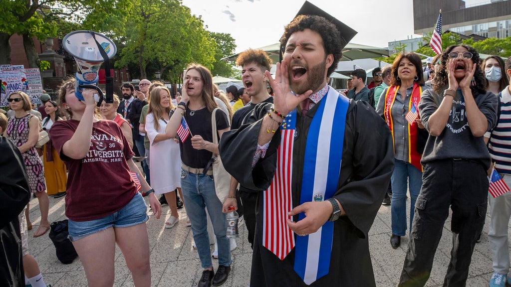 Harvard students rally for international classmates whose status ...