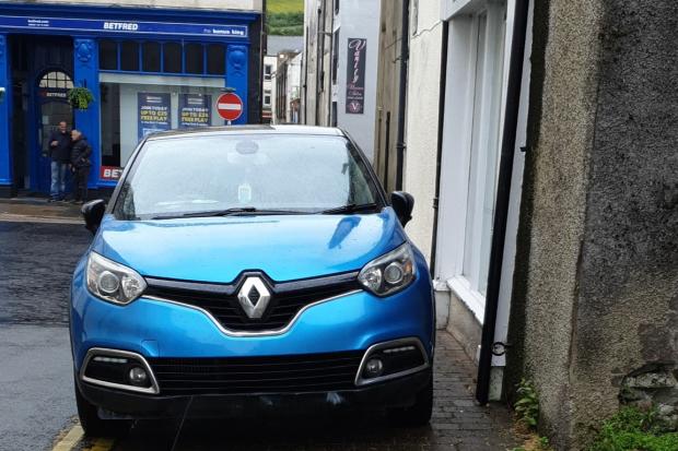Police issue parking ticket to car for causing 'unnecessary obstruction'