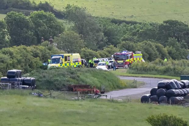 Three people taken to hospital following A35 crash