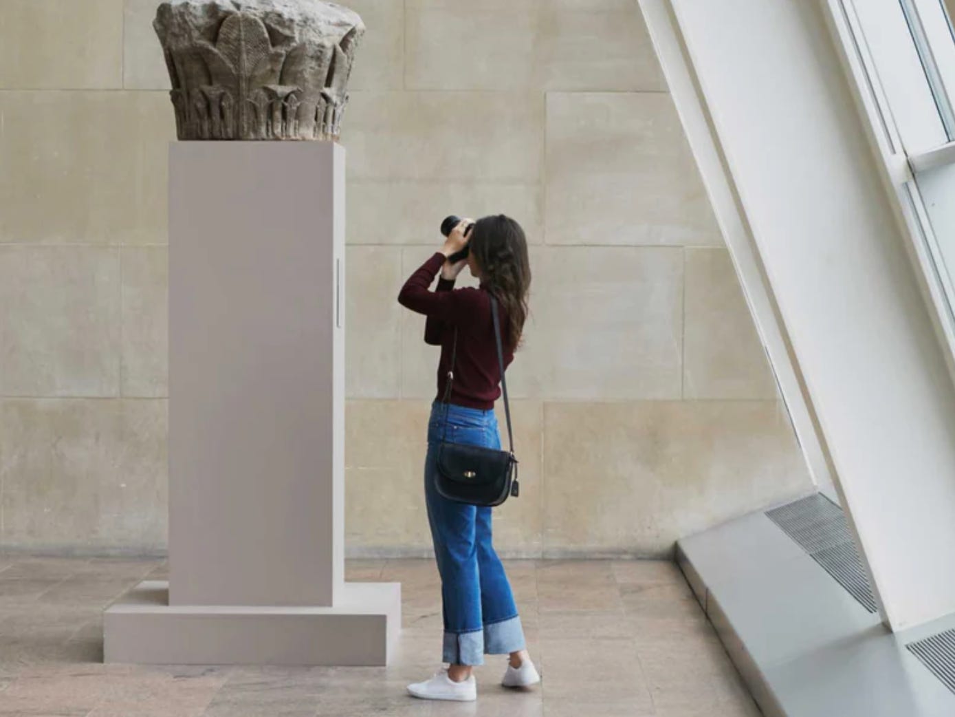 This crossbody is actually a sophisticated DSLR camera bag in disguise ...