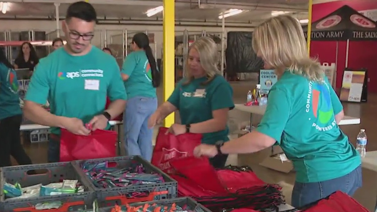 APS volunteers pack heat relief kits at Salvation Army
