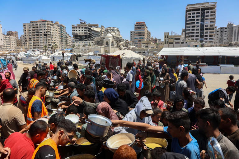 Food aid in Gaza looted hours after Palestinians overran distribution site