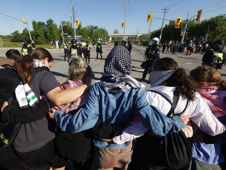 Police arrest 13 protesters opposing CANSEC military trade show