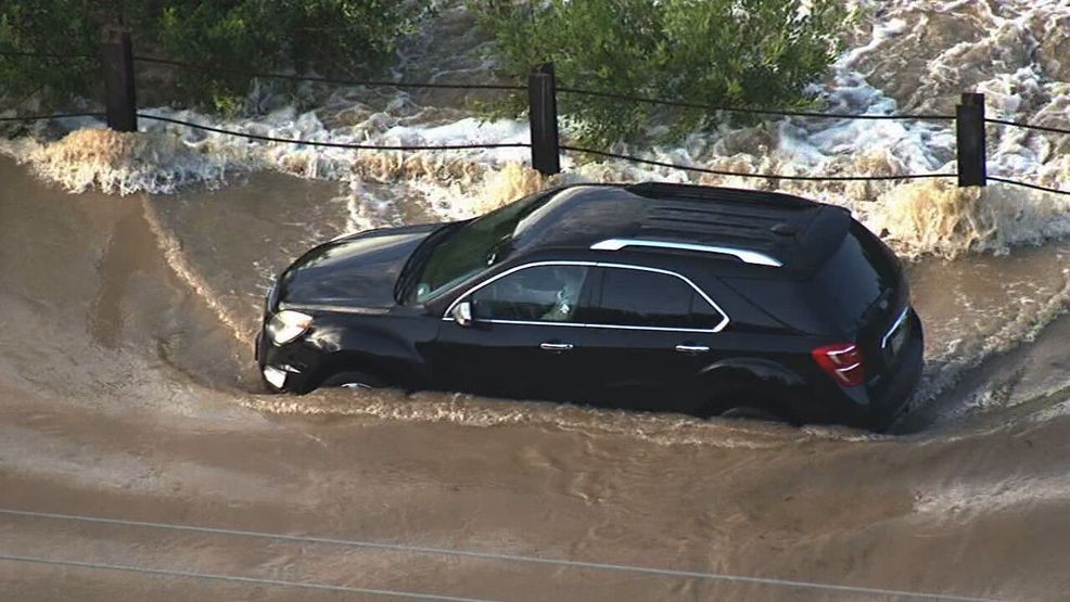 PHOTOS: Firefighters rescue driver stranded in high waters