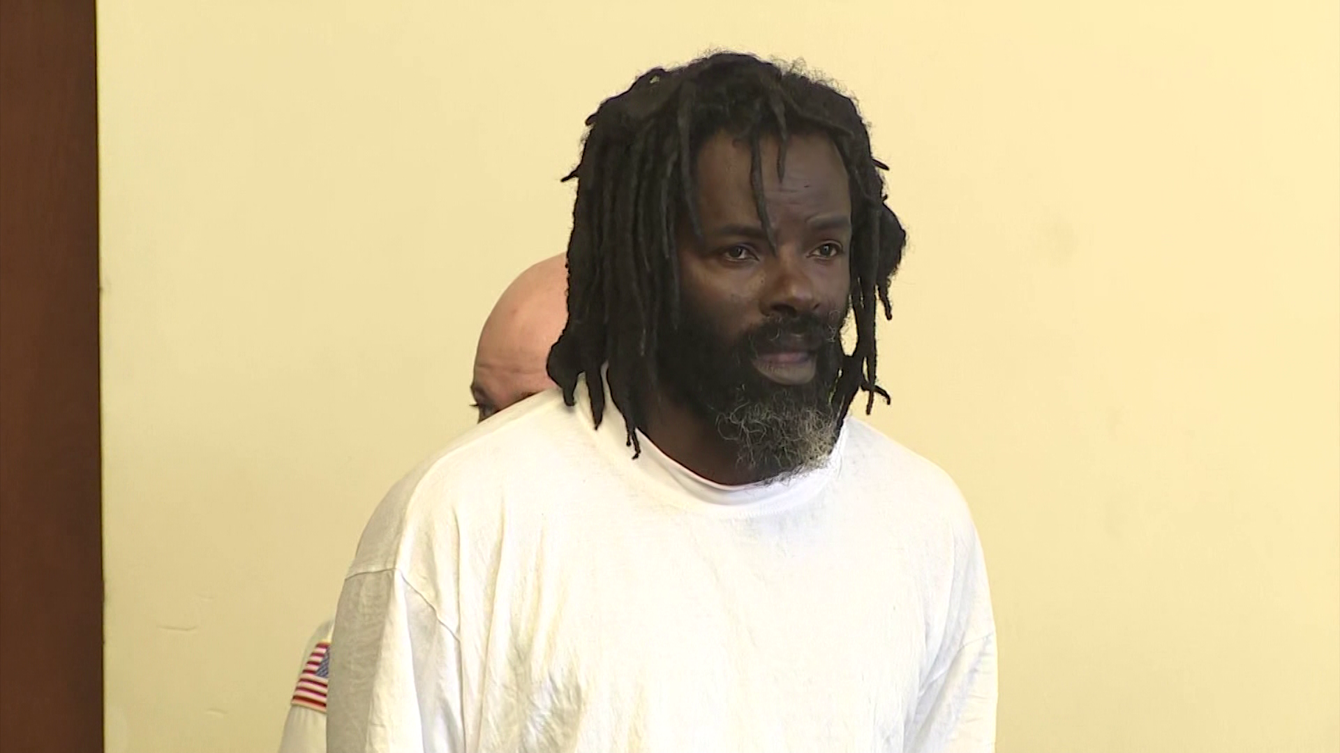 Man accused of shooting self with police officer's gun appears in court