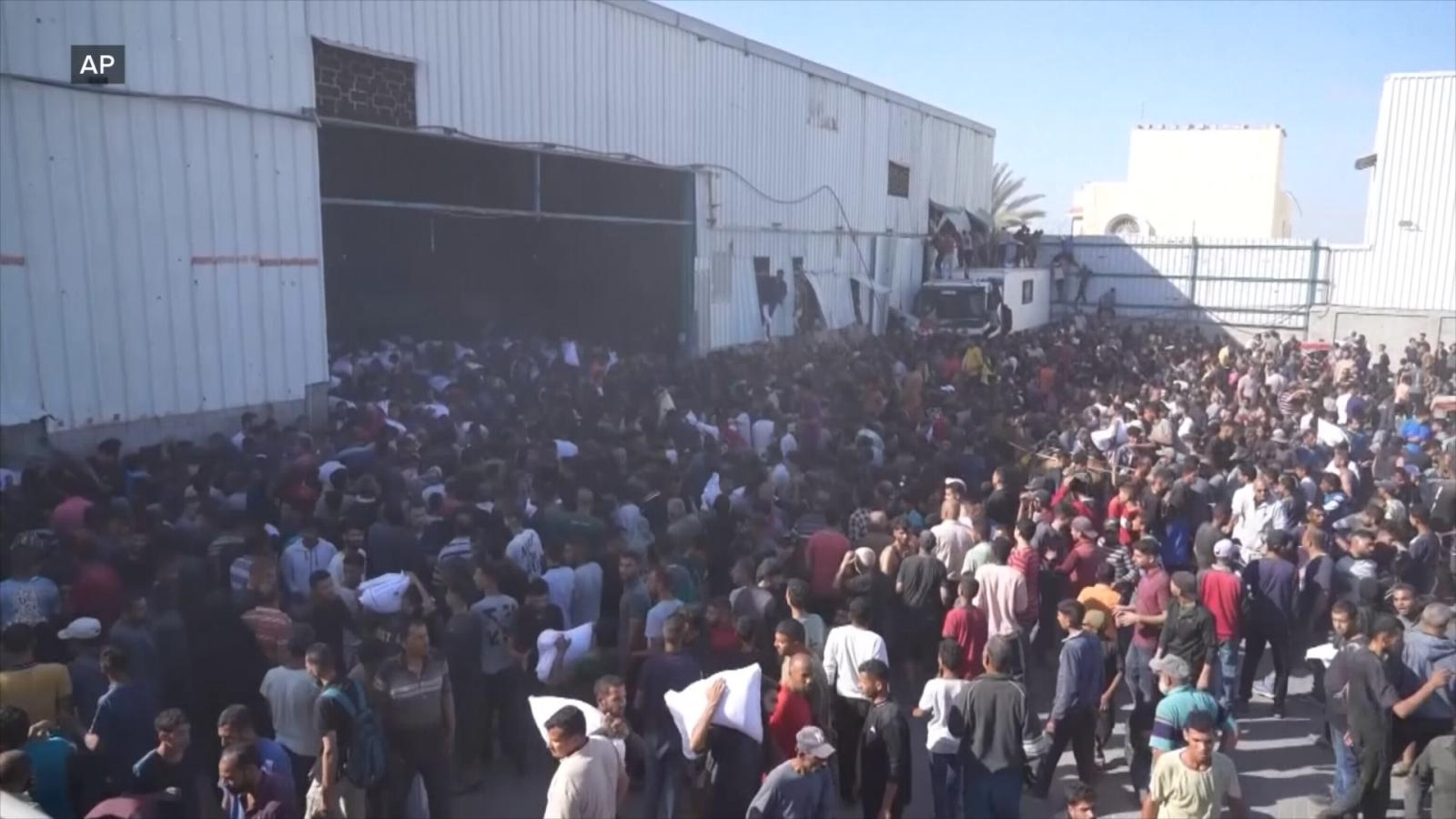 Hundreds storm food warehouse in Gaza as starvation crisis grows