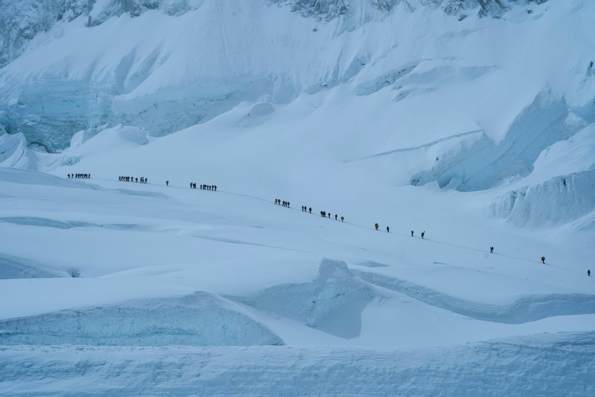 AP PHOTOS: Hundreds scale Mount Everest in a weather-hit climbing season