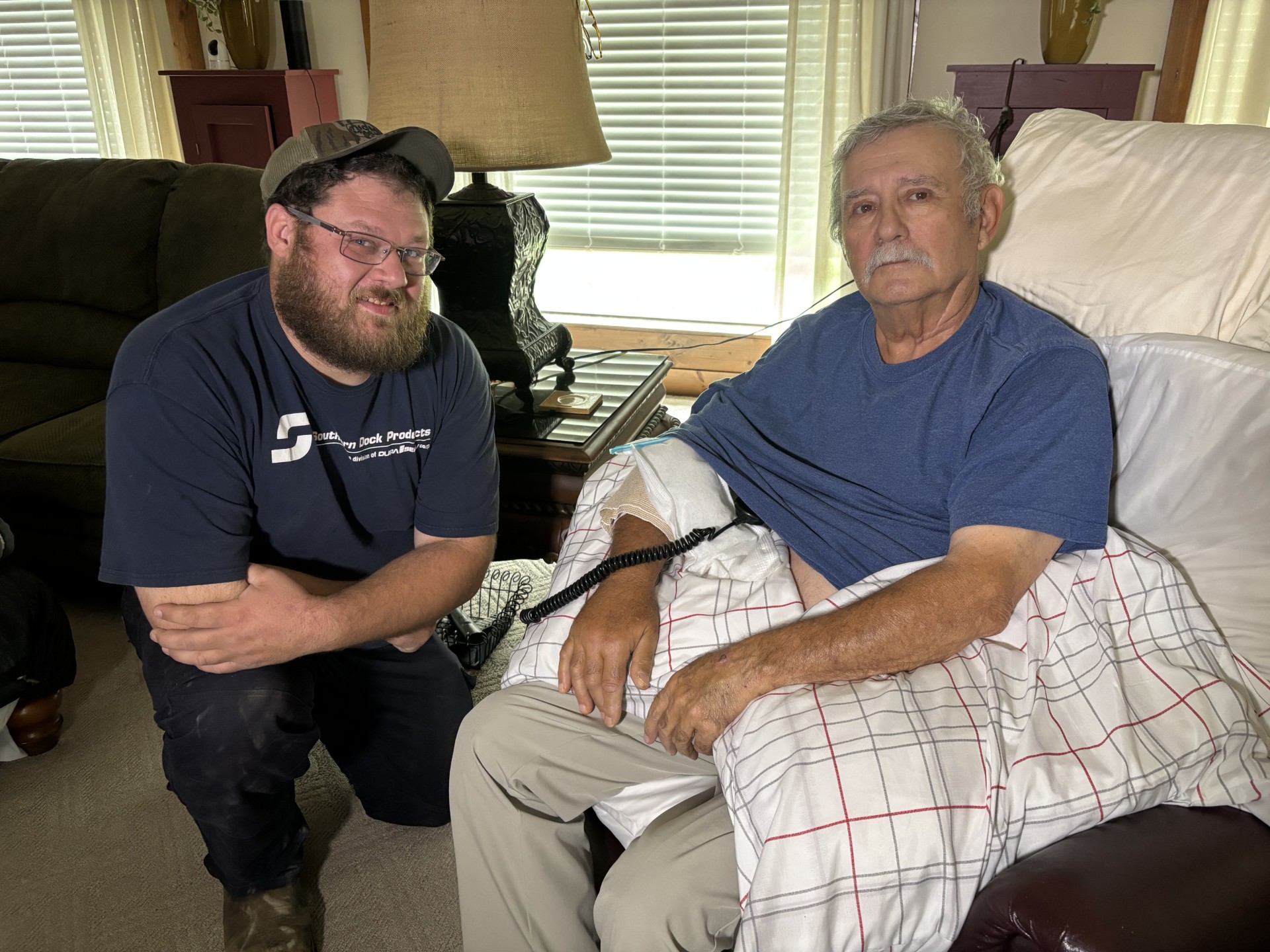 Neighbor saves man’s life after tree pins him on tractor