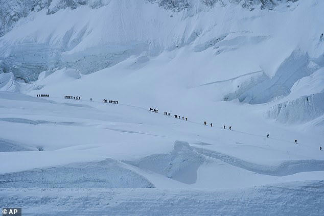 The queue at the top of the world: Dozens of climbers wait to reach the ...