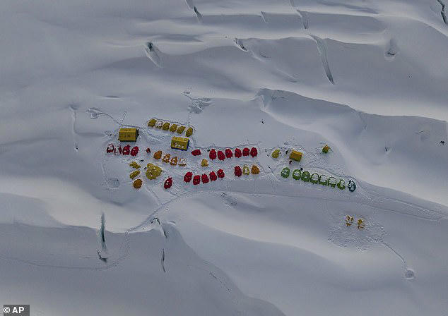 The queue at the top of the world: Dozens of climbers wait to reach the ...