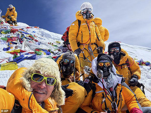 The queue at the top of the world: Dozens of climbers wait to reach the ...