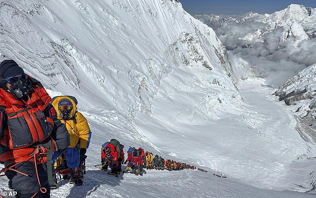 The queue at the top of the world: Dozens of climbers wait to reach the ...