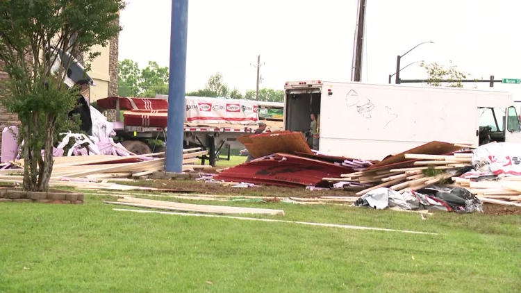 Major delays after 18-wheeler crashes into hotel in Shelby