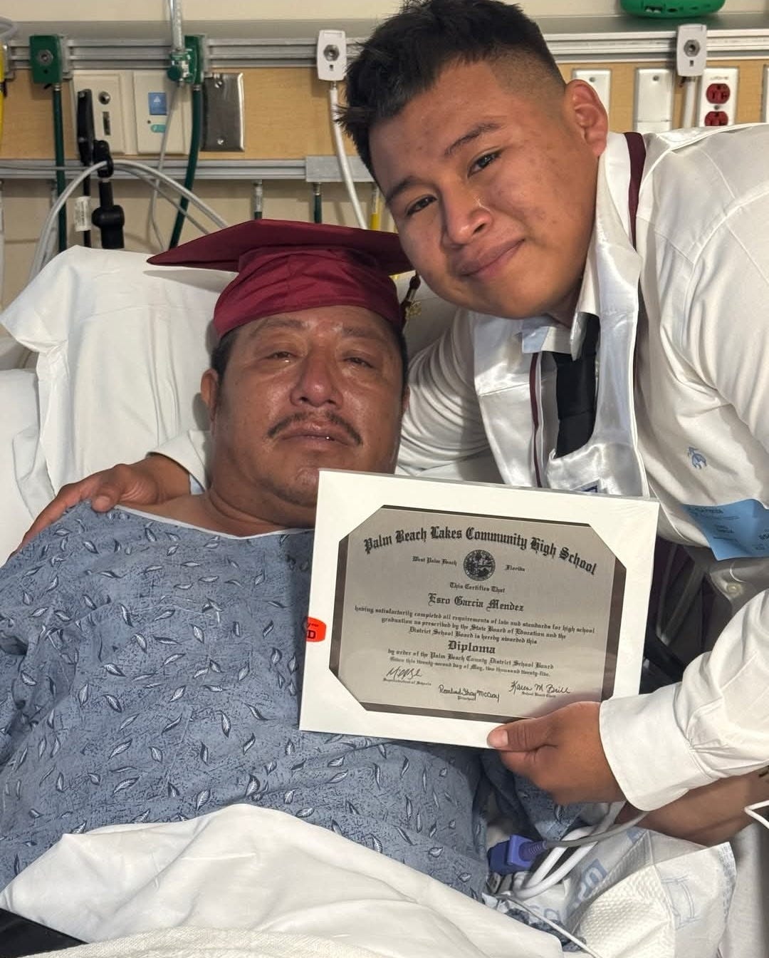 Son celebrates his high school graduation with visit to ailing father