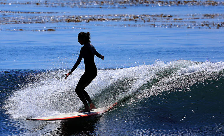 Photos | Riding a wave at Steamer Lane