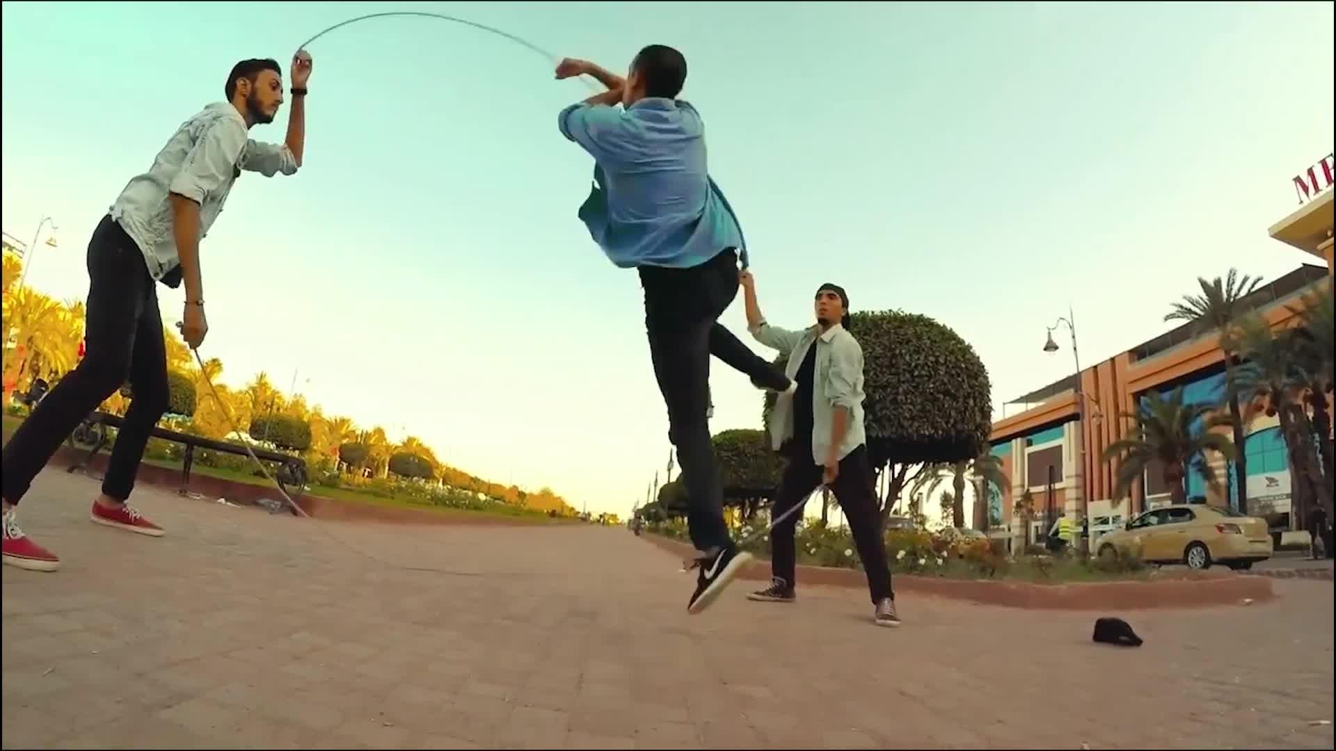 Men Dance while Doing Double Dutch