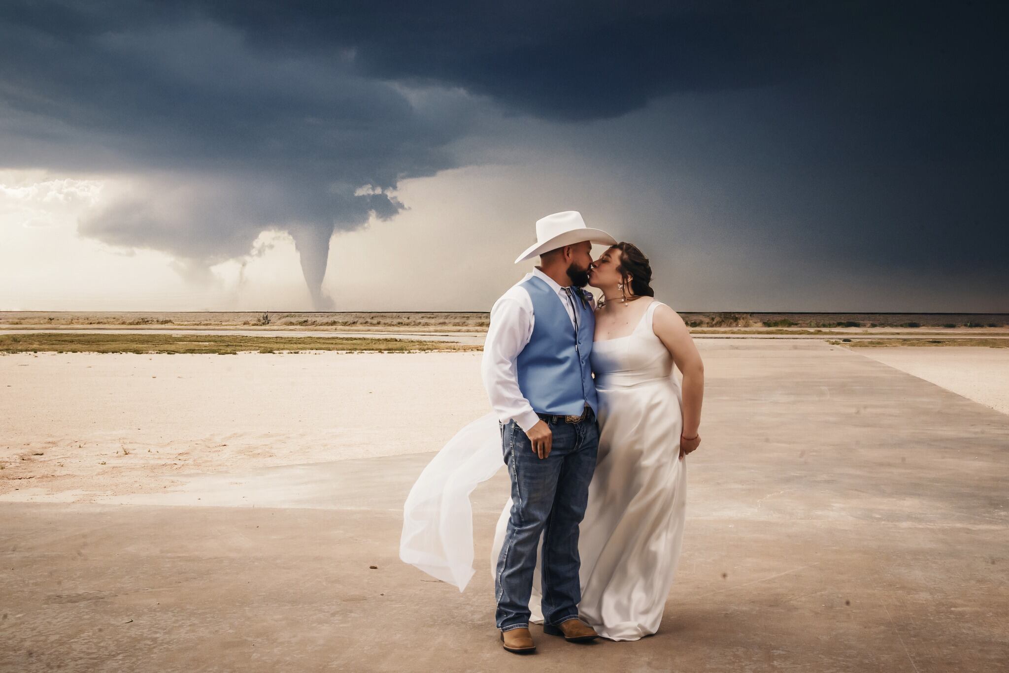 Couple uses tornado as backdrop for a wedding day photo