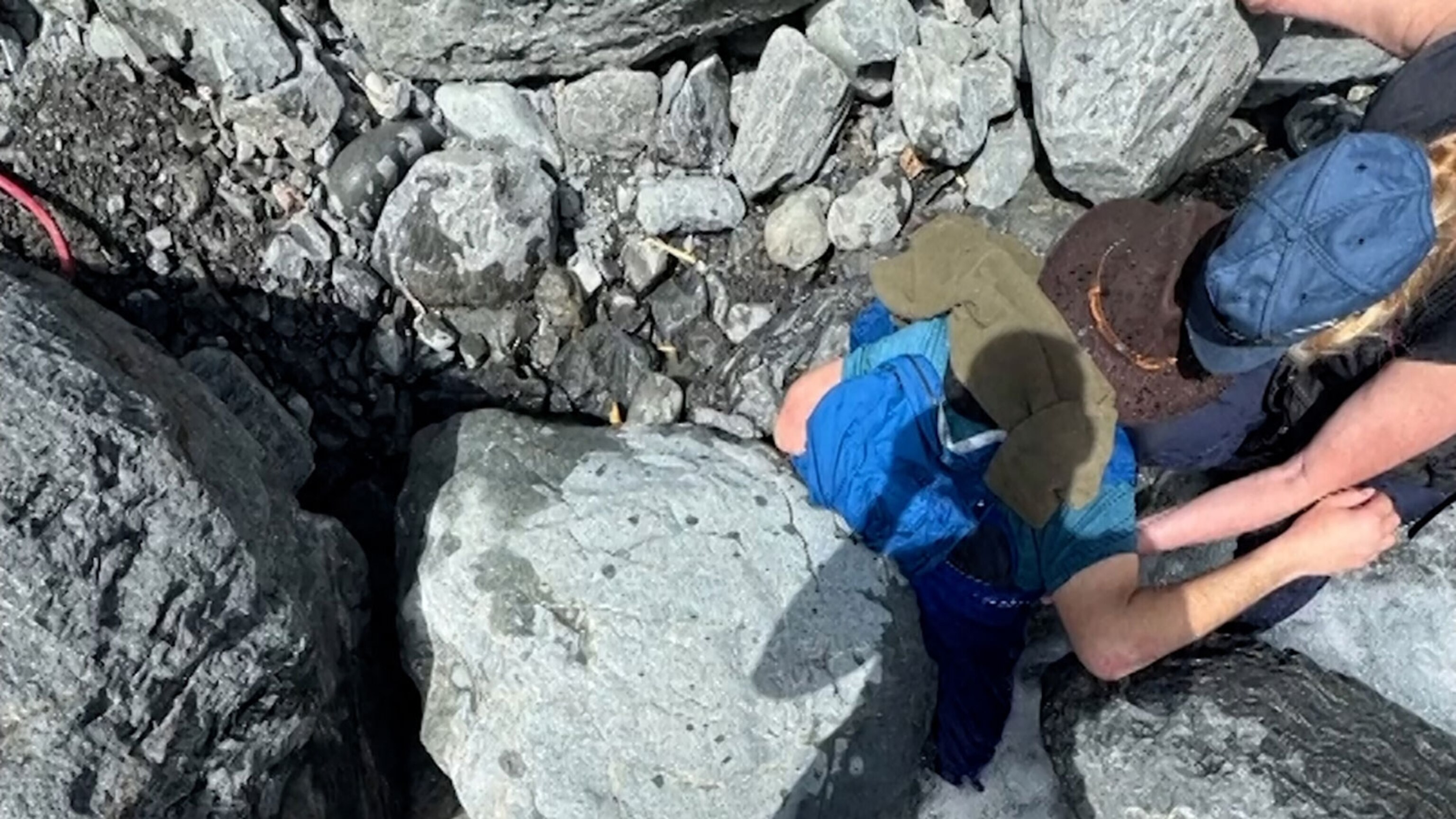 Man survives being pinned down by 700-pound boulder for 3 hours in ...