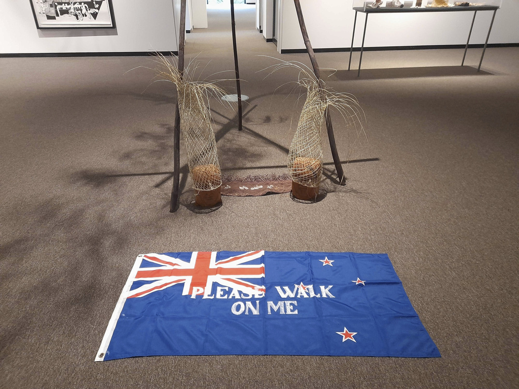 A controversial flag invited art gallery visitors to 'please walk on me ...