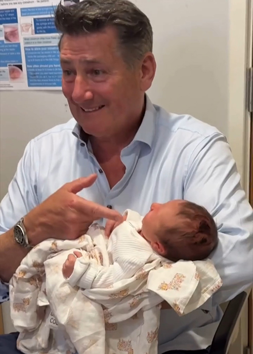 Spandau Ballet's Tony Hadley beams with joy as he meets first grandchild