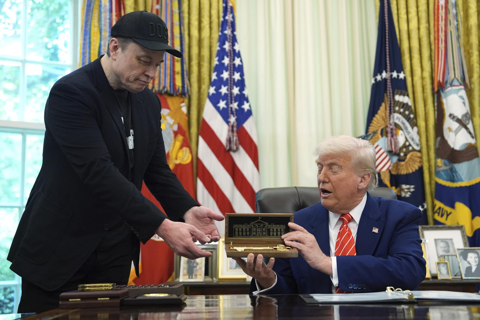 Trump awards Elon Musk a golden key for his DOGE work as he gives Musk ...
